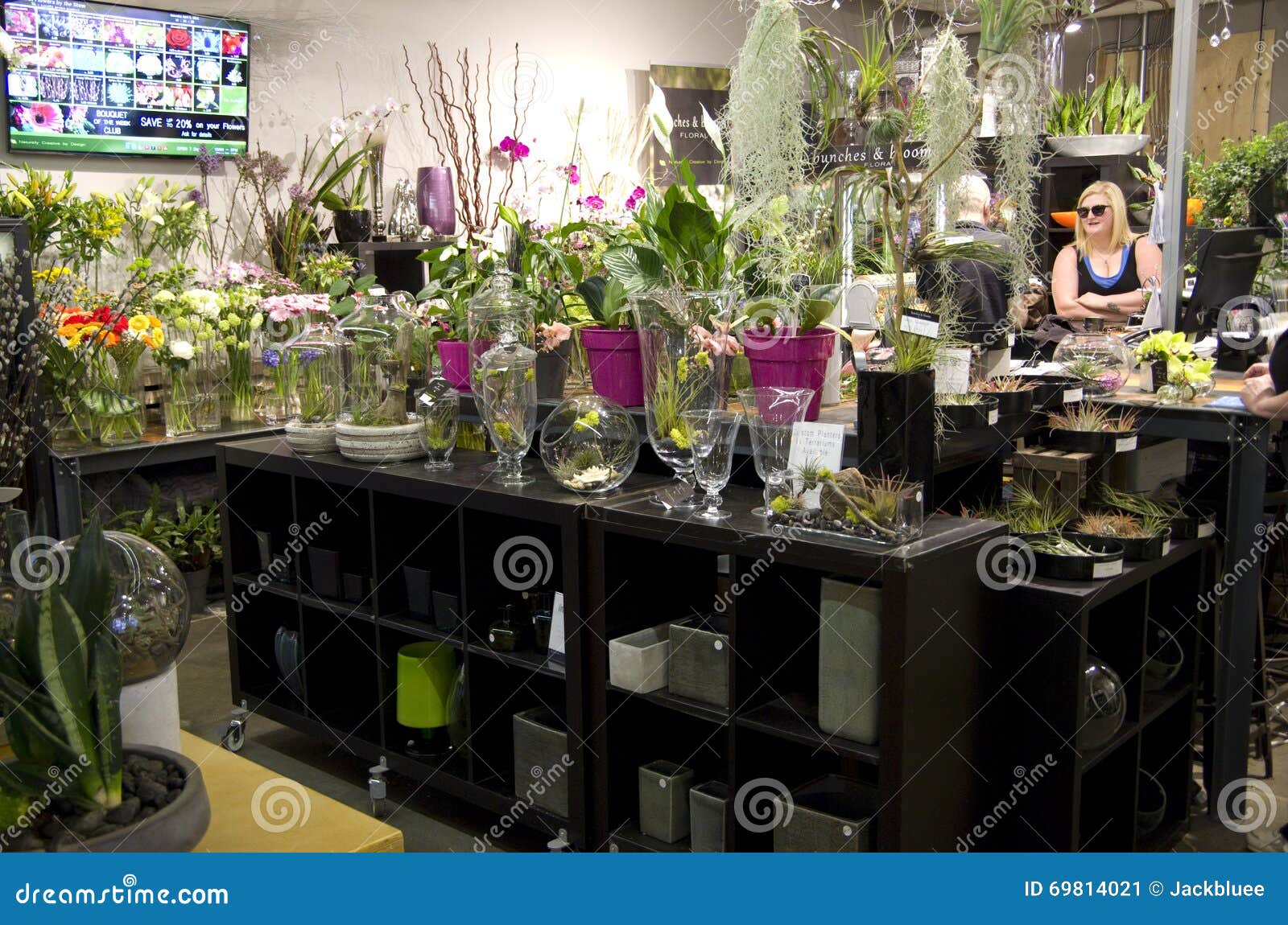 A Flower Shop Vendor Standing Inside His Stall At Dadar Flower Market ...