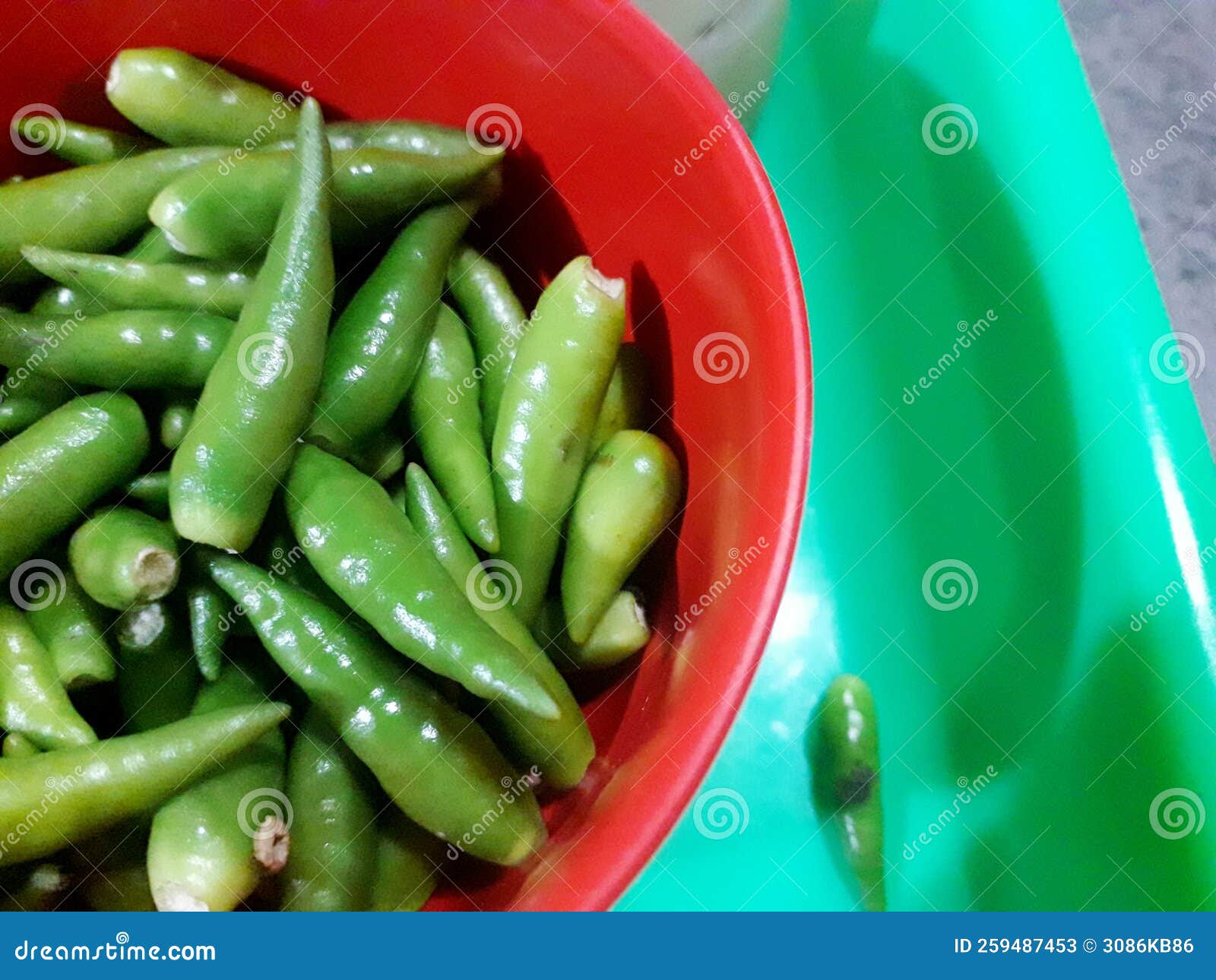 Small Fresh Green Chilies in a Plastic Bowl Stock Image - Image of ...