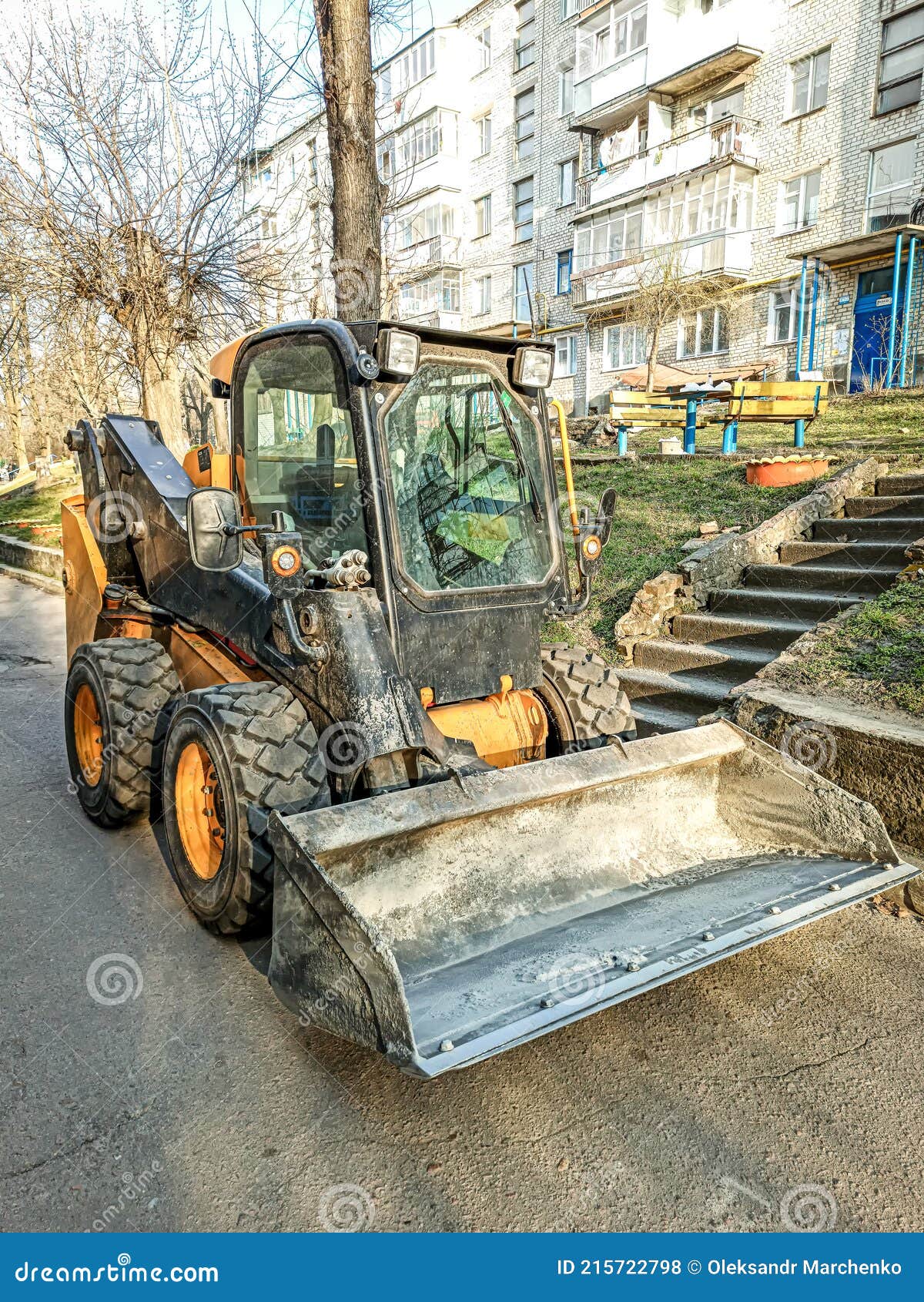 Small Front-end Loader for Loading and Unloading on City Streets. Stock ...