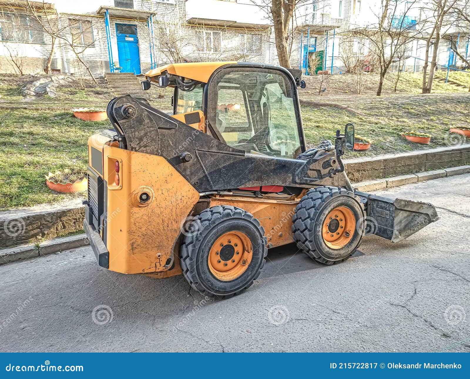 Small Front-end Loader for Loading and Unloading on City Streets. Stock ...