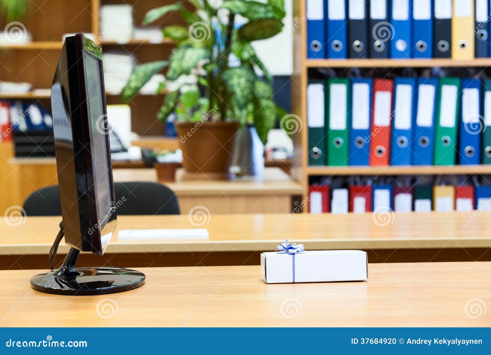 Small Gift Box Laing in Front of Monitor Screen Stock Photo - Image of ...