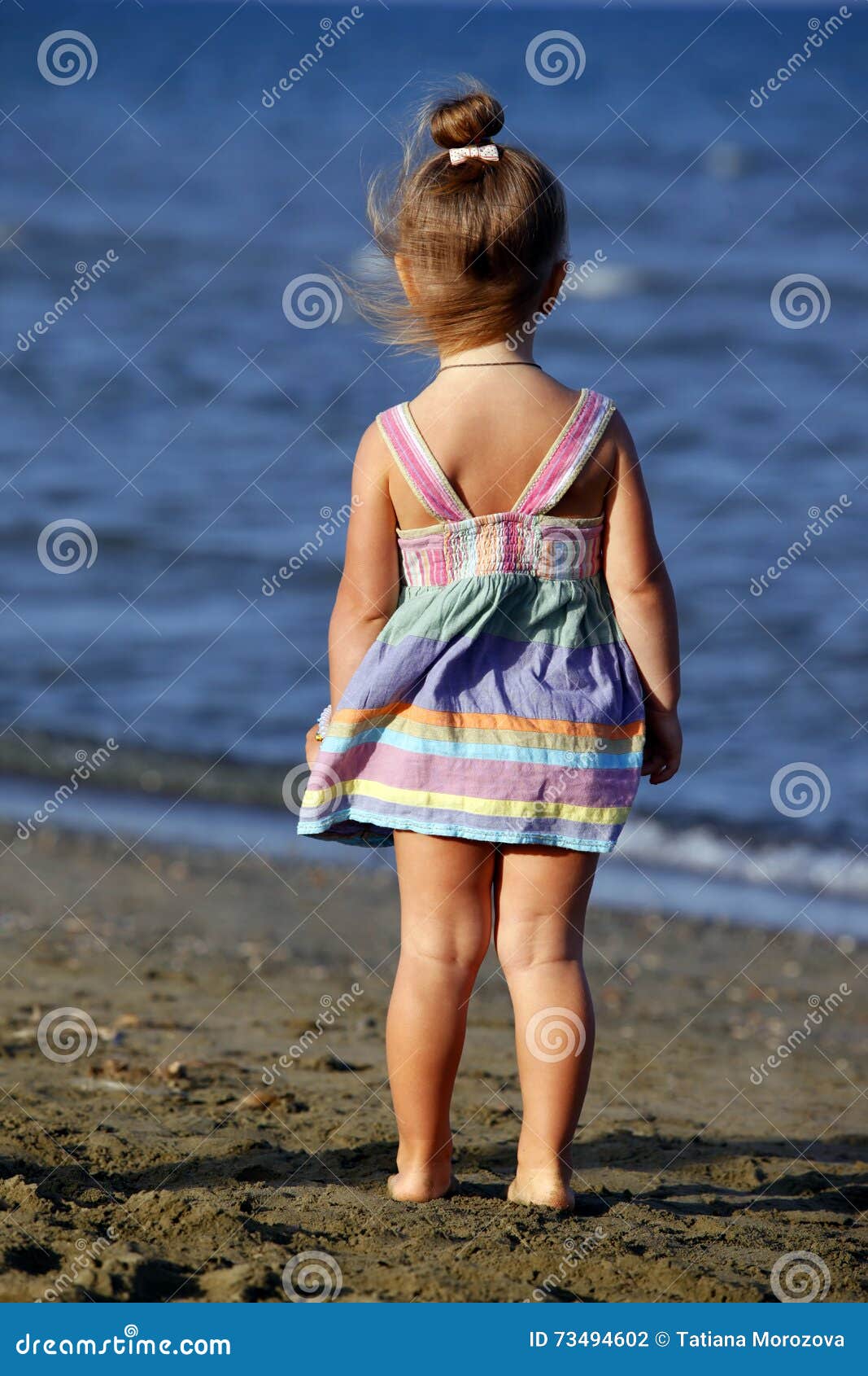 Small girl on the beach stock photo. Image of freshness - 73494602