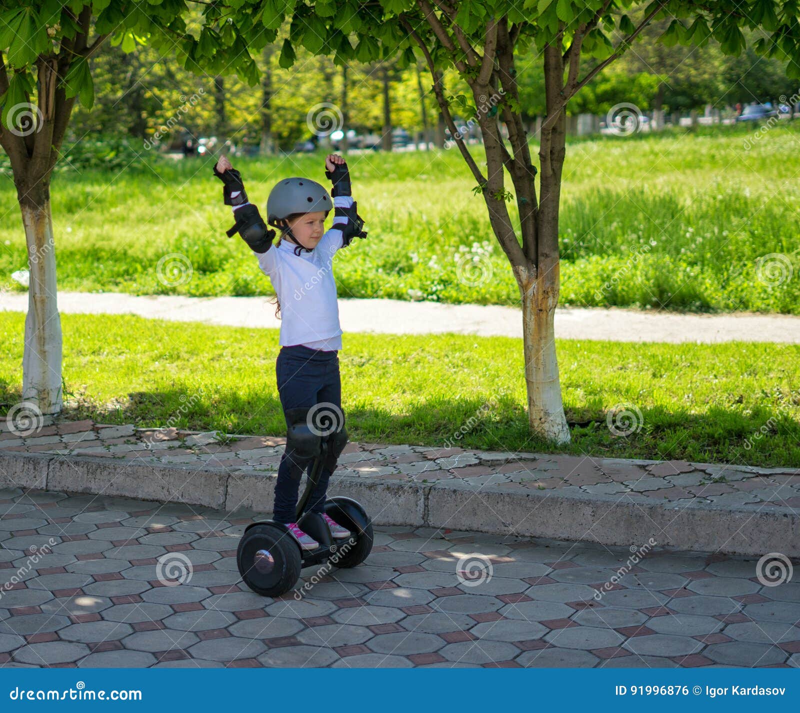 Small Girl Learns To Ride Electric Mini Hoverboard Stock Photo - Image ...