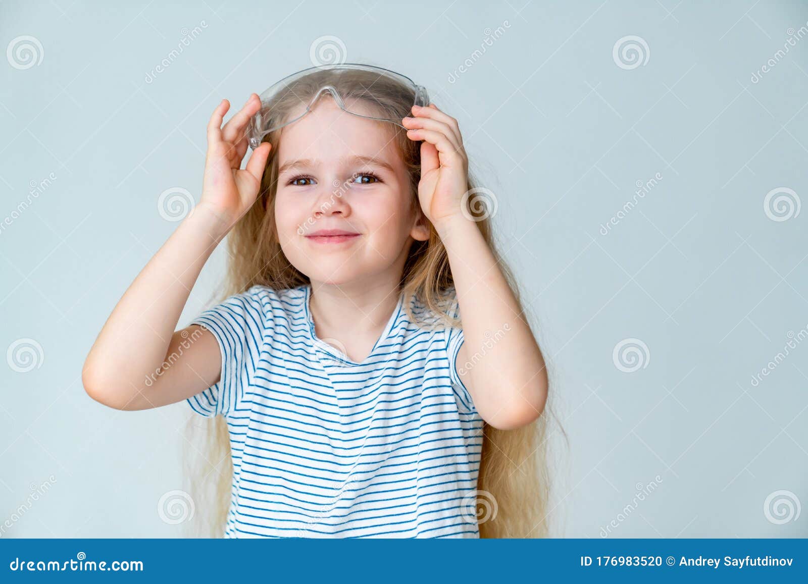 Small Girl Put on Safety Goggles. Stock Photo - Image of childhood ...