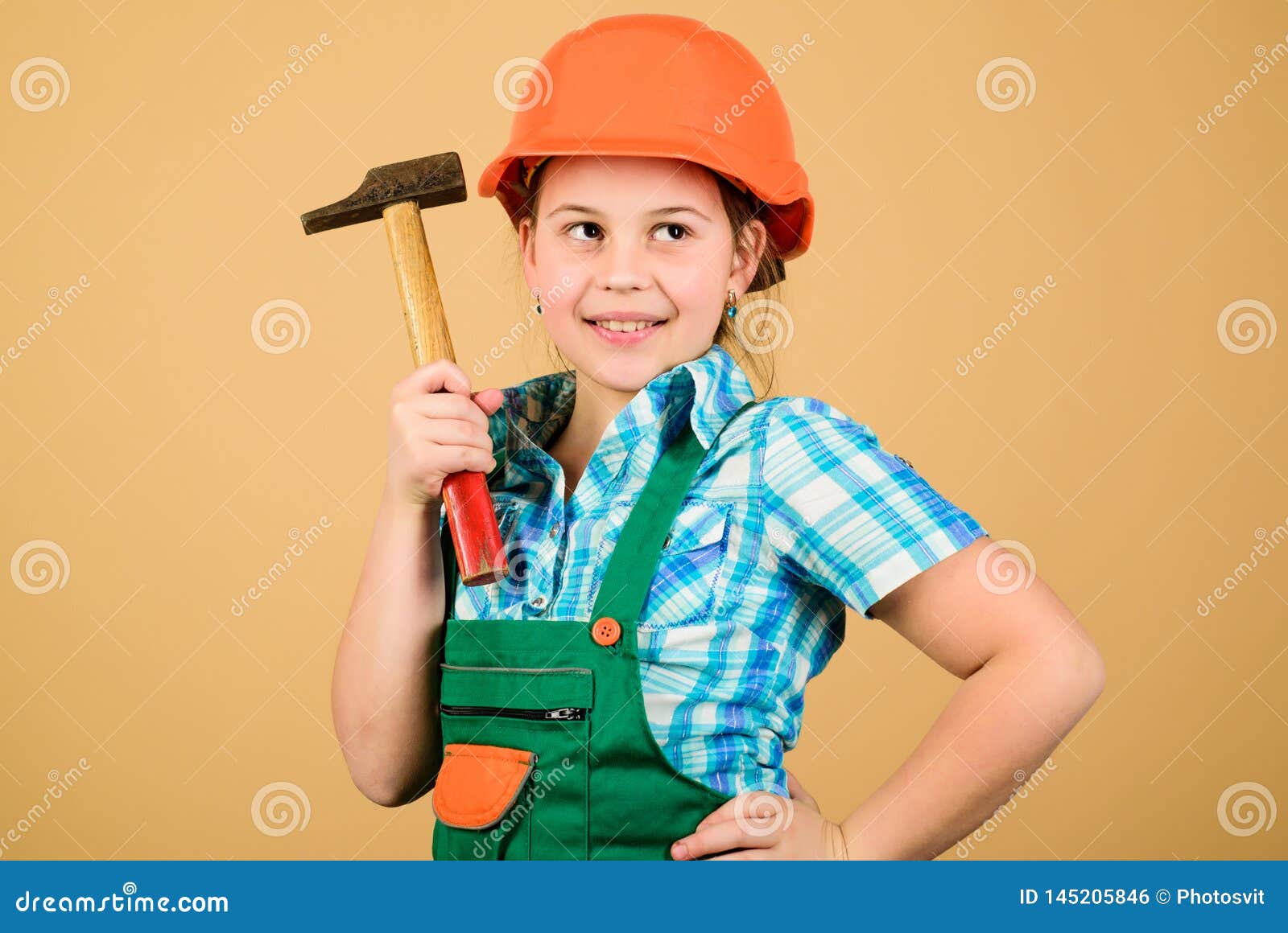 Small Girl Repairing with Hammer in Workshop. Future Profession ...