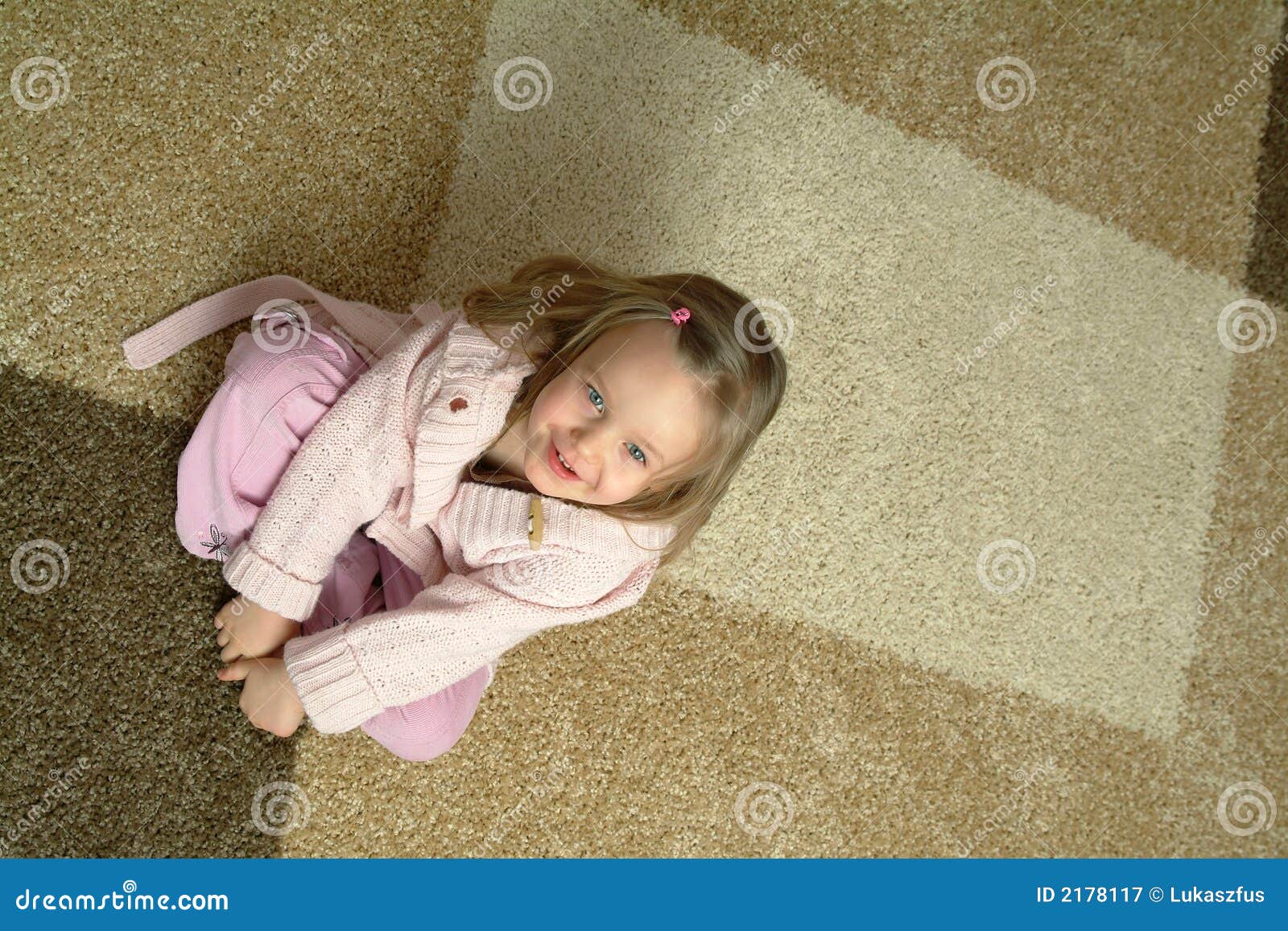 Small Girl Sitting on Carpet Stock Image - Image of carpeting, youth ...