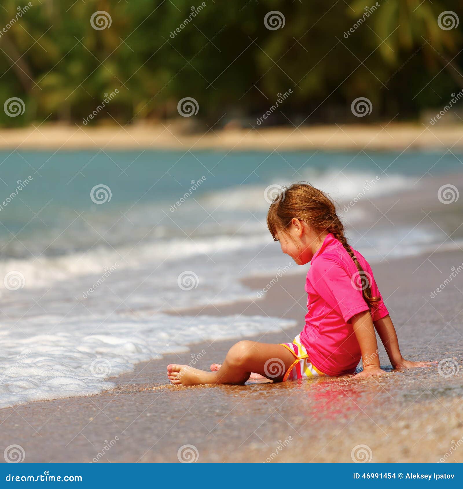 Small girl sitting on sand stock photo. Image of girl - 46991454