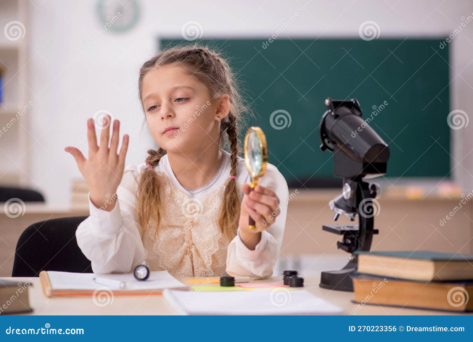 Small Girl Studying in the Classroom Stock Photo - Image of sitting ...