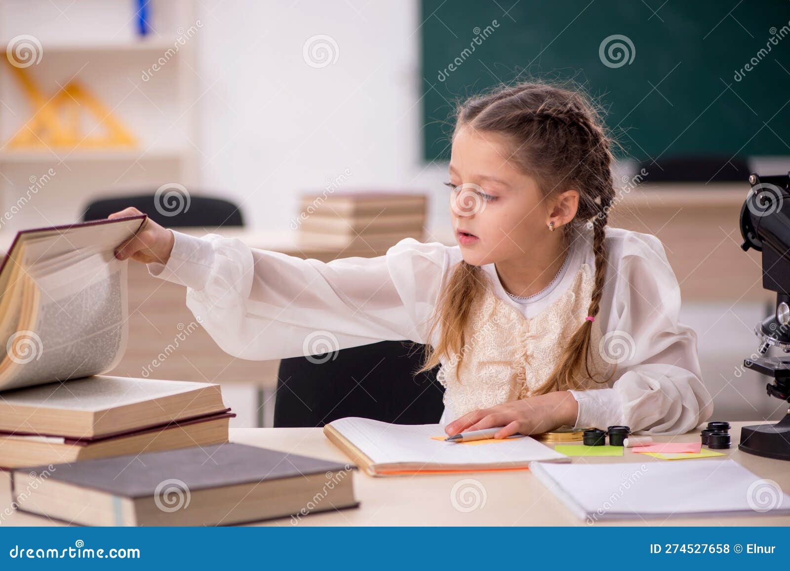 Small Girl Studying in the Classroom Stock Photo - Image of biology ...