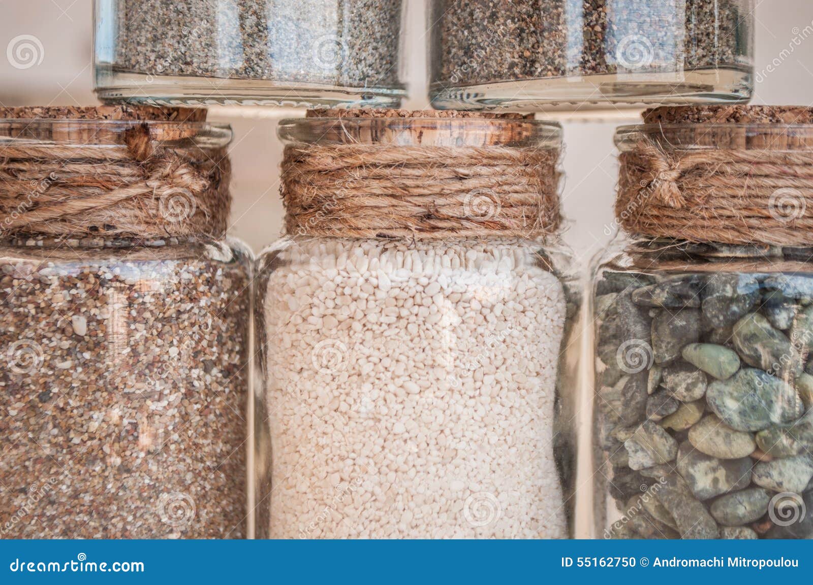 Small Glass Bottles with Sand and Rocks Stock Photo - Image of outdoors ...