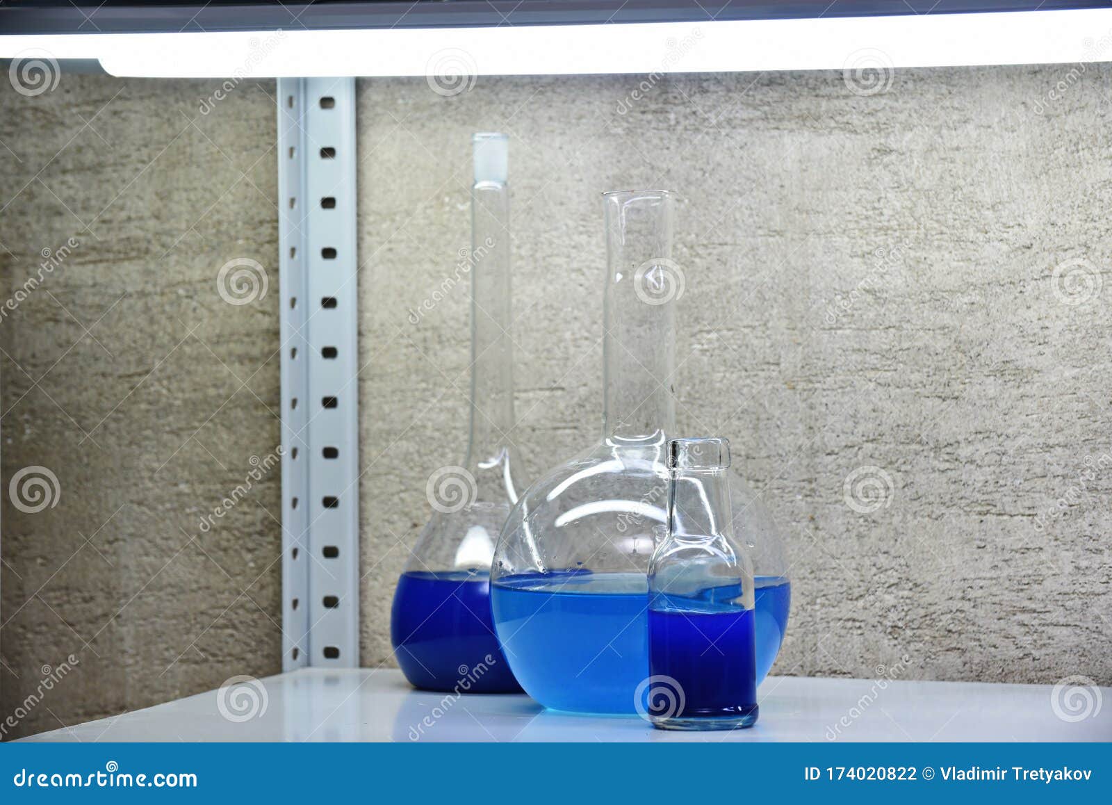 Small Glass Container with Liquid on the Background of Other Flasks ...