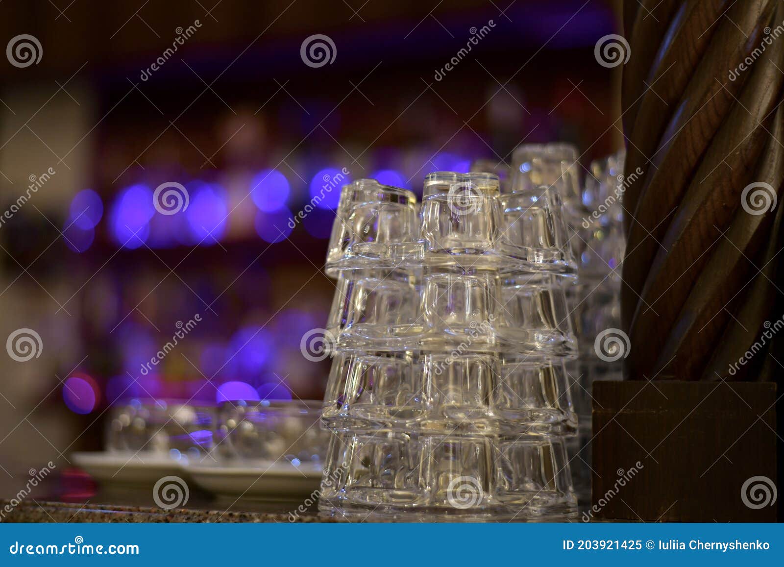 Small Glass Cups with Neat Stack Vertical Rows on the Bar. Amid the ...