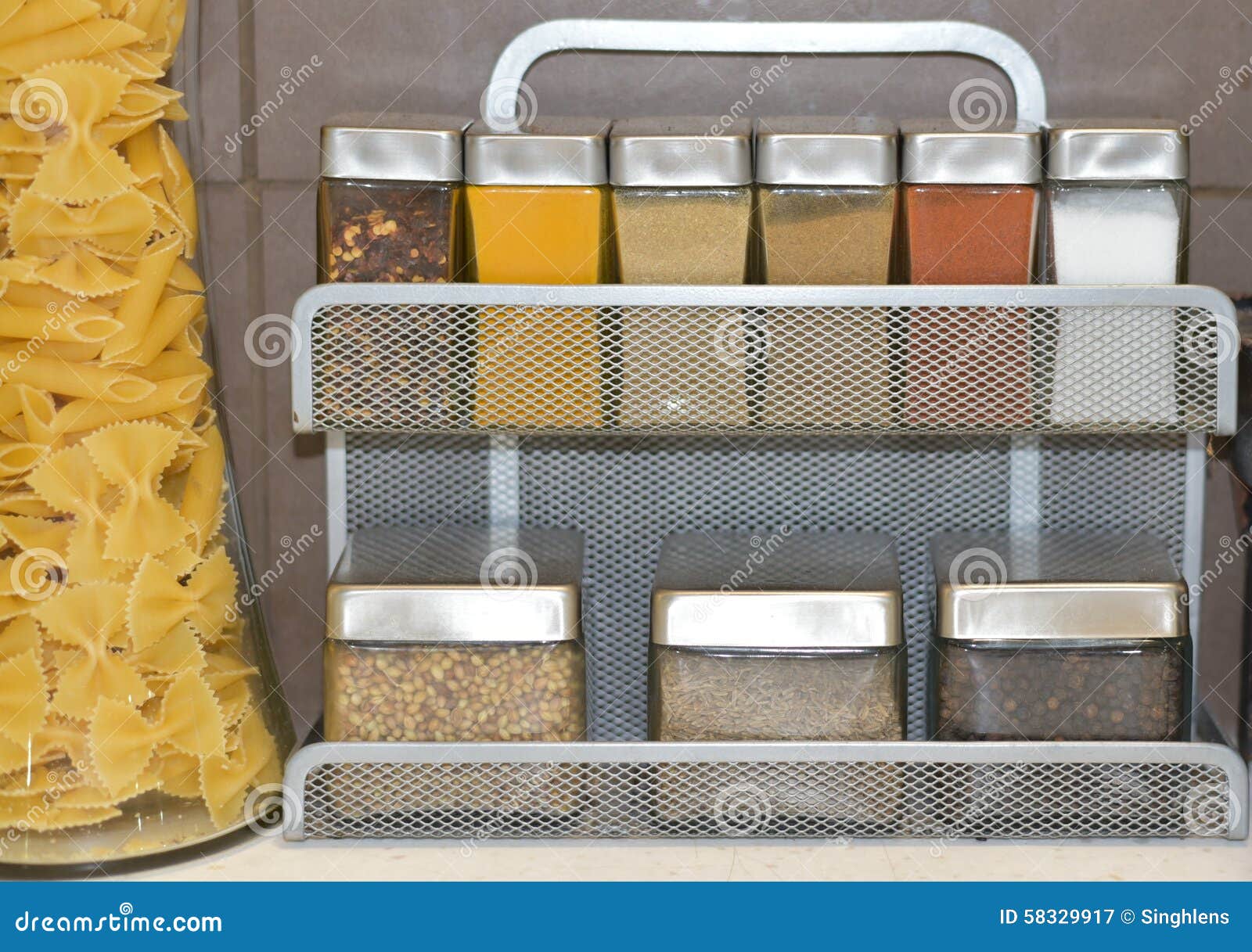 Small Glass Jars with Spices and Other Kitchen Condiments on a Kitchen ...