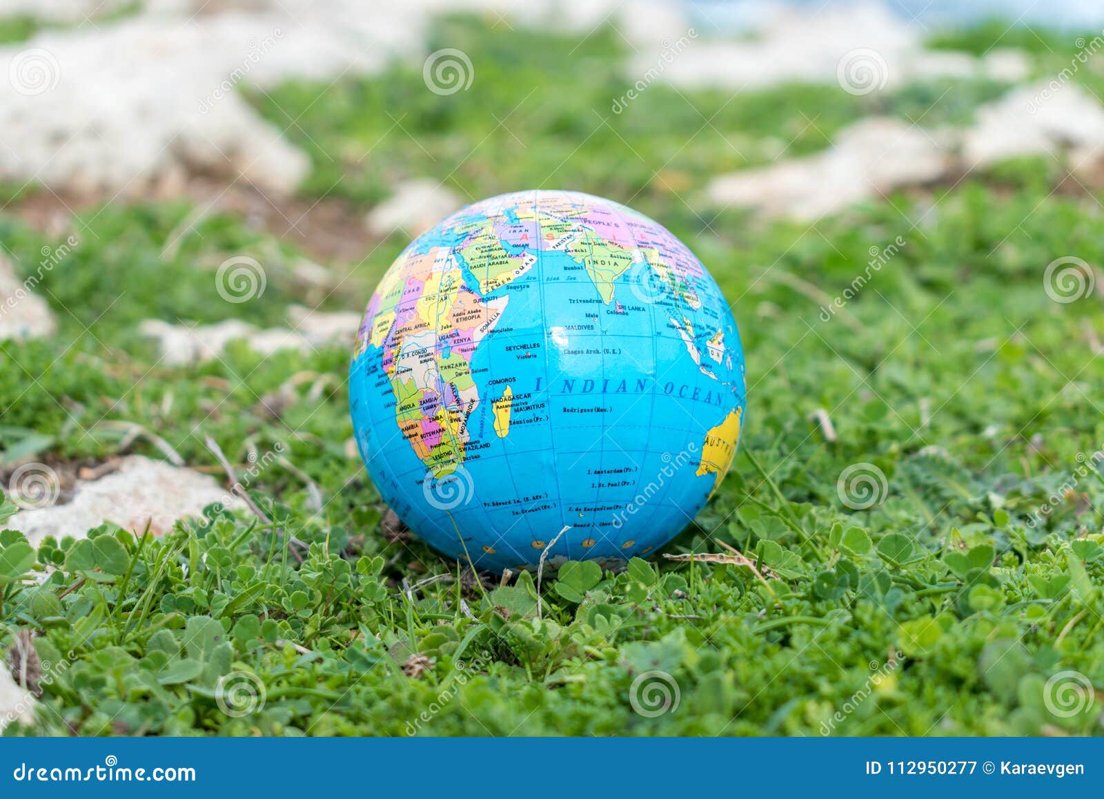 Small globe in the grass. stock image. Image of enviroment - 112950277