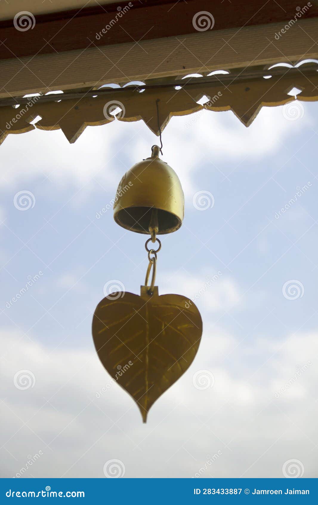 A Small Golden Bell that Hangs Over the Eaves in a Thai Temple Stock ...