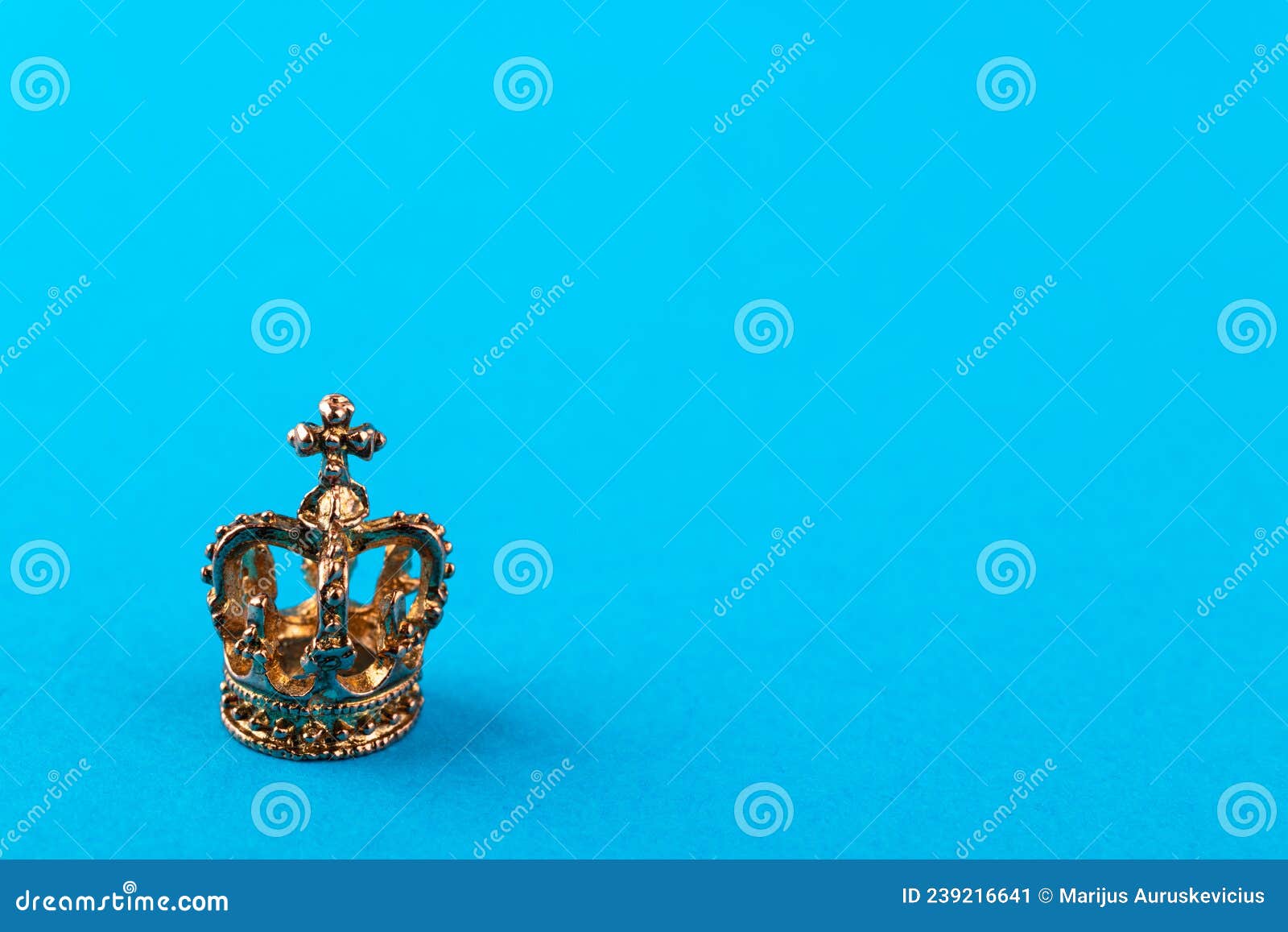 Small Golden Crown on Blue Background Stock Image - Image of corona ...