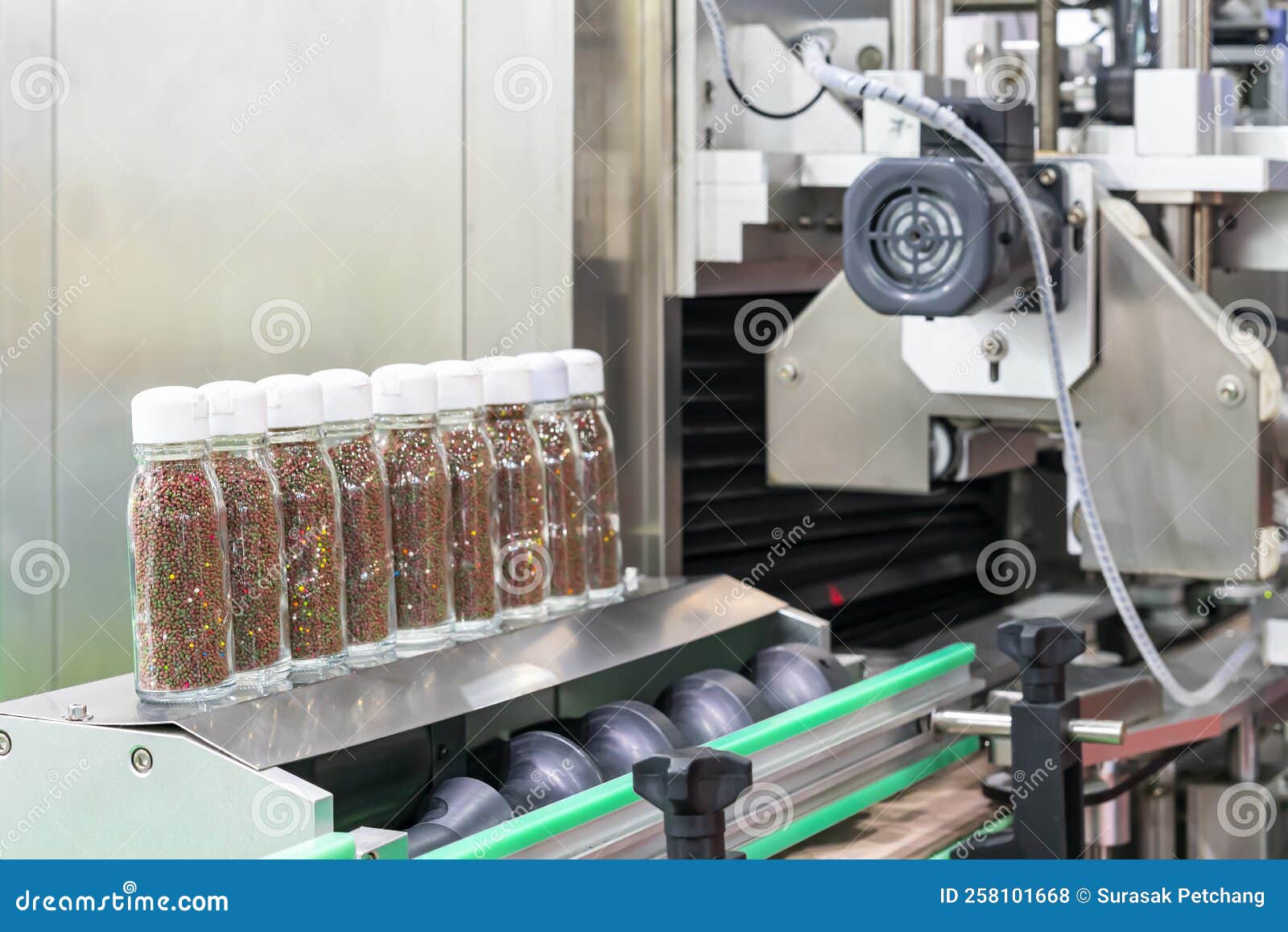 Small Grain Like Product in Clear Bottle Glass are Placed Arrange Row ...