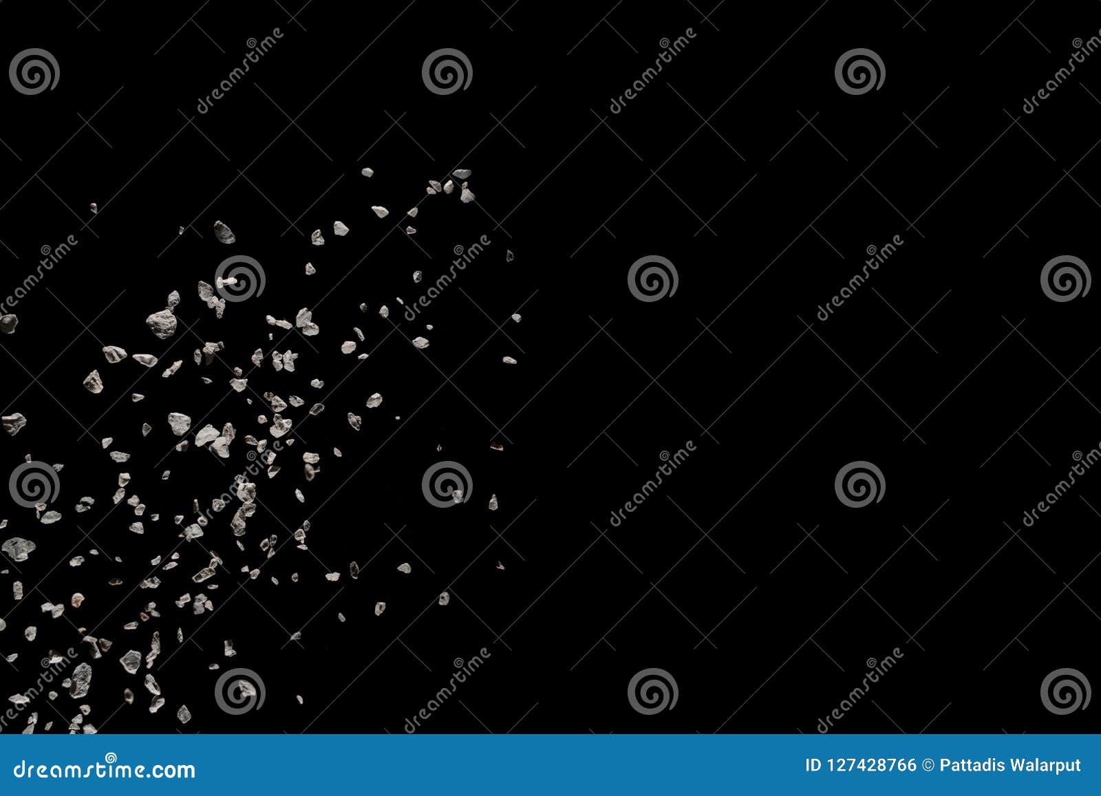 Small Granite Rock Stone Splash Against Dark Background. Royalty-Free ...