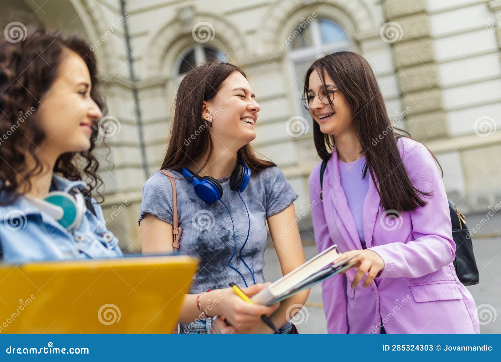Group of Students Studying Outside of Their Campus and Talking about ...