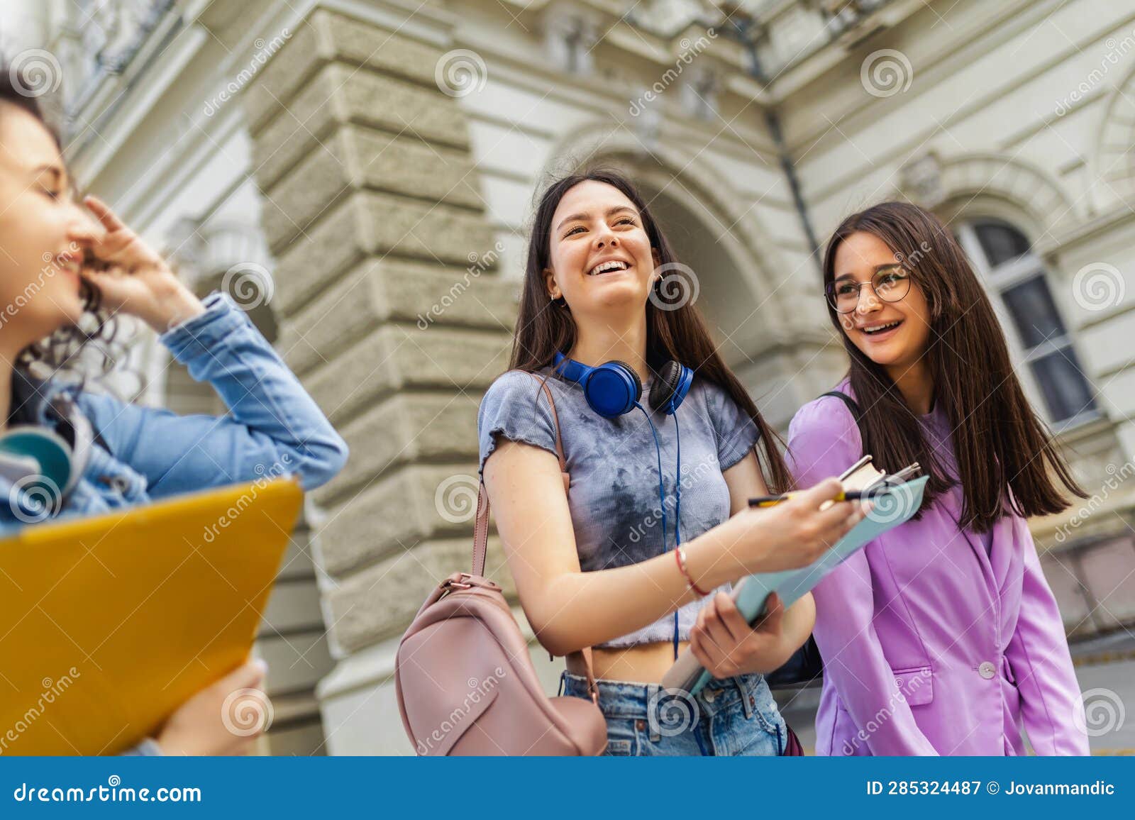 Group of Students Studying Outside of Their Campus and Talking about ...