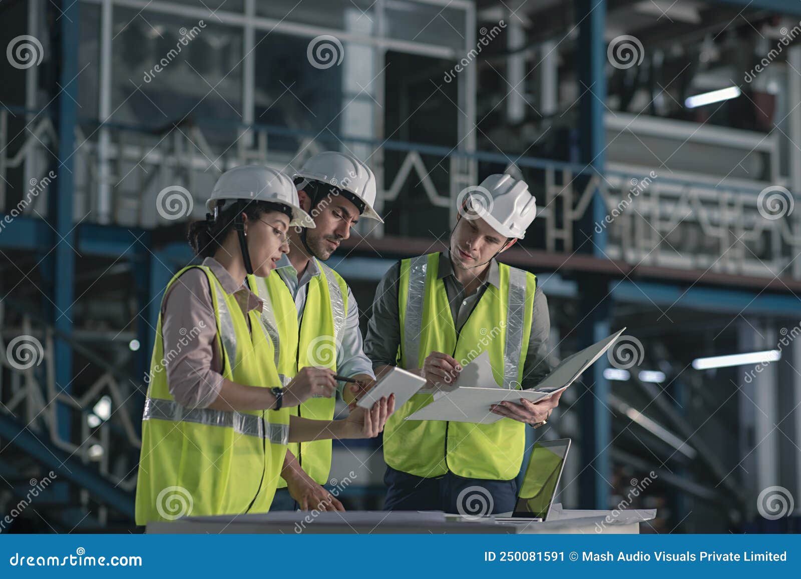 Small Group of Technical Engineers Working on Digital Tablet in the ...