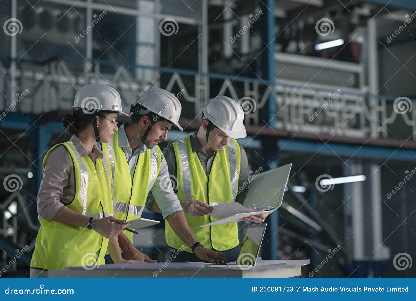 Small Group of Technical Engineers Working in the Factory Stock Image ...