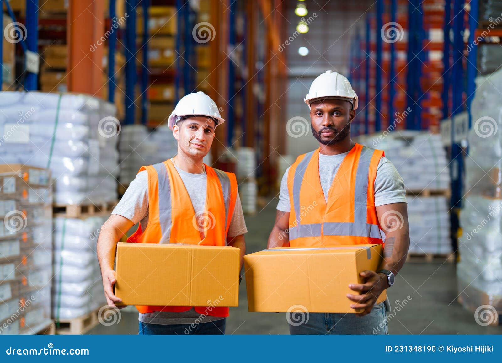 A Small Group of Warehouse Workers Standing in a Large Distribution ...