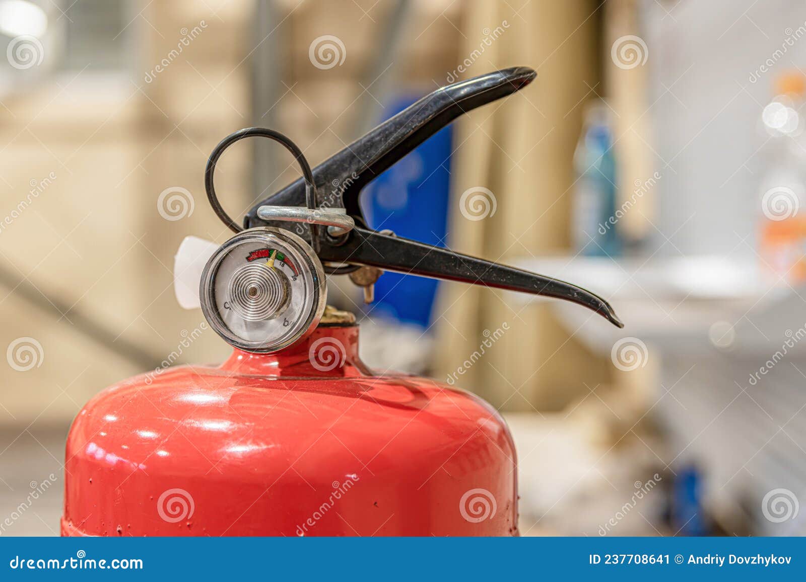 Small Hand-held Fire Extinguisher with Pressure Gauge in a Locksmith`s ...