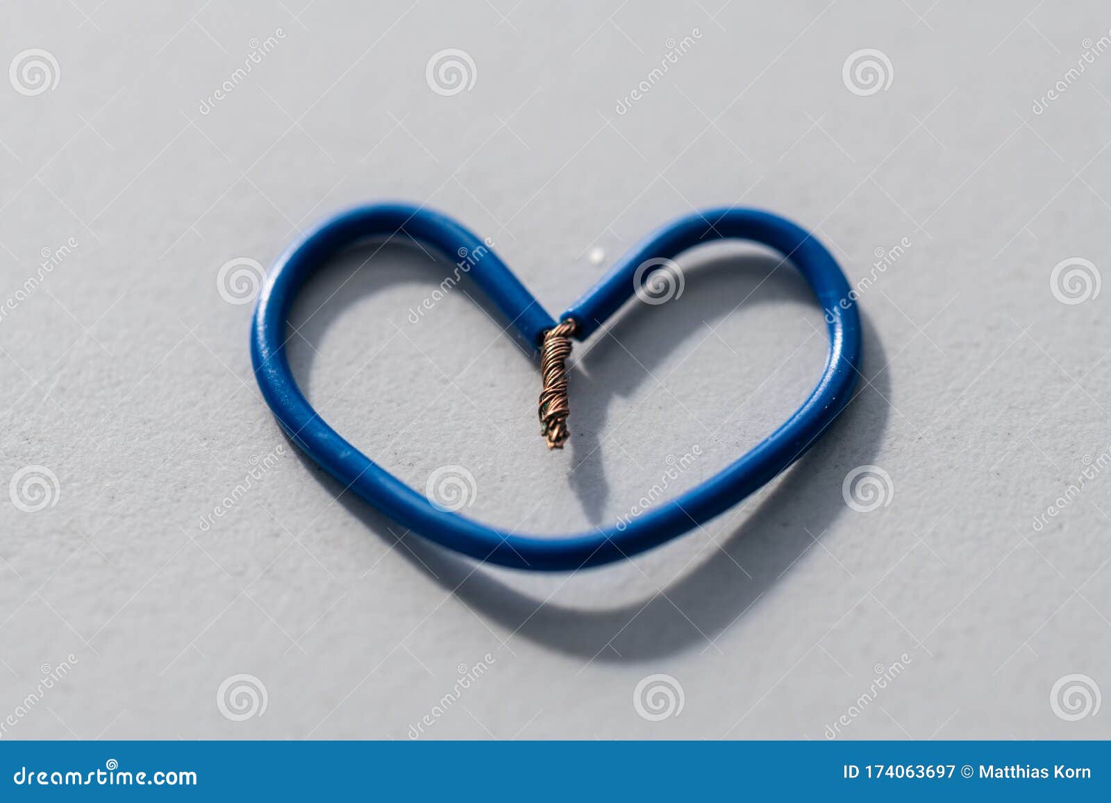 A Small Heart Made from Blue Cables on a Gray Background Stock Image ...