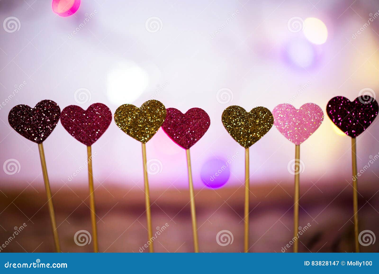 Small Hearts In A Row, Lights In The Background Stock Image - Image of ...