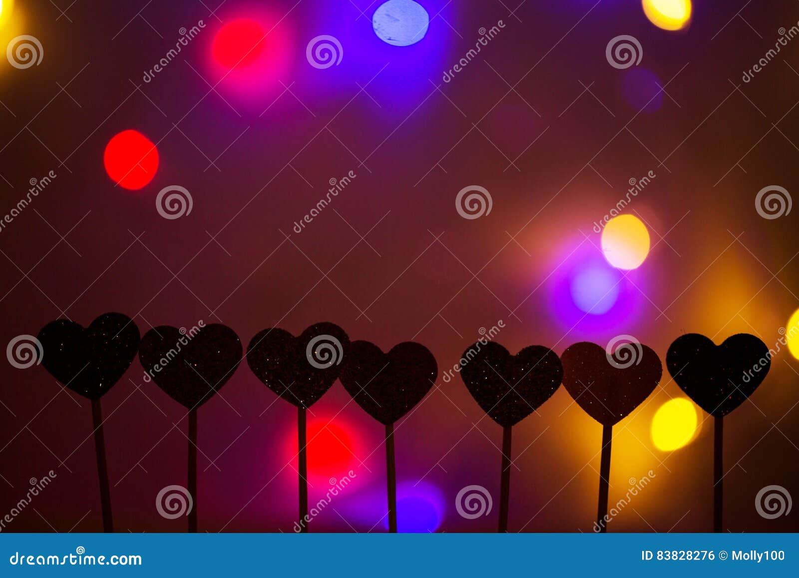 Small Hearts in a Row, Lights in the Background Stock Photo - Image of ...