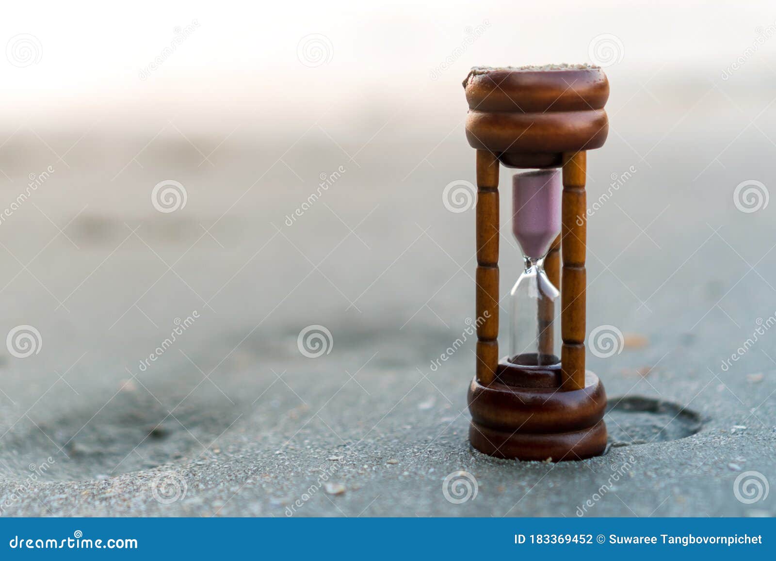 Small Hourglass Show Time is Flowing on Sand Beach Background Stock ...