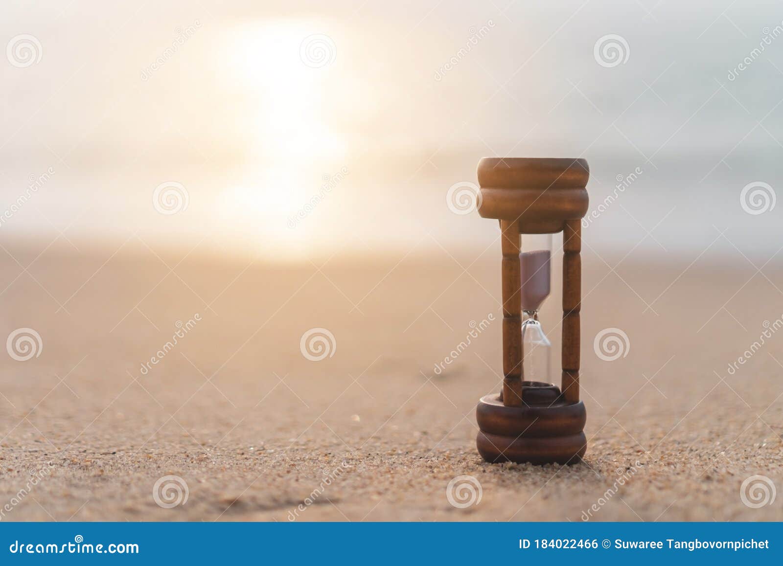 Small Hourglass Show Time is Flowing on Sand Beach Background Stock ...