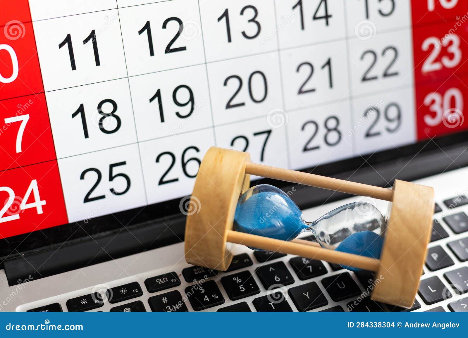 Small Hourglass Stands on the Calendar, Counting the Time. the Concept ...