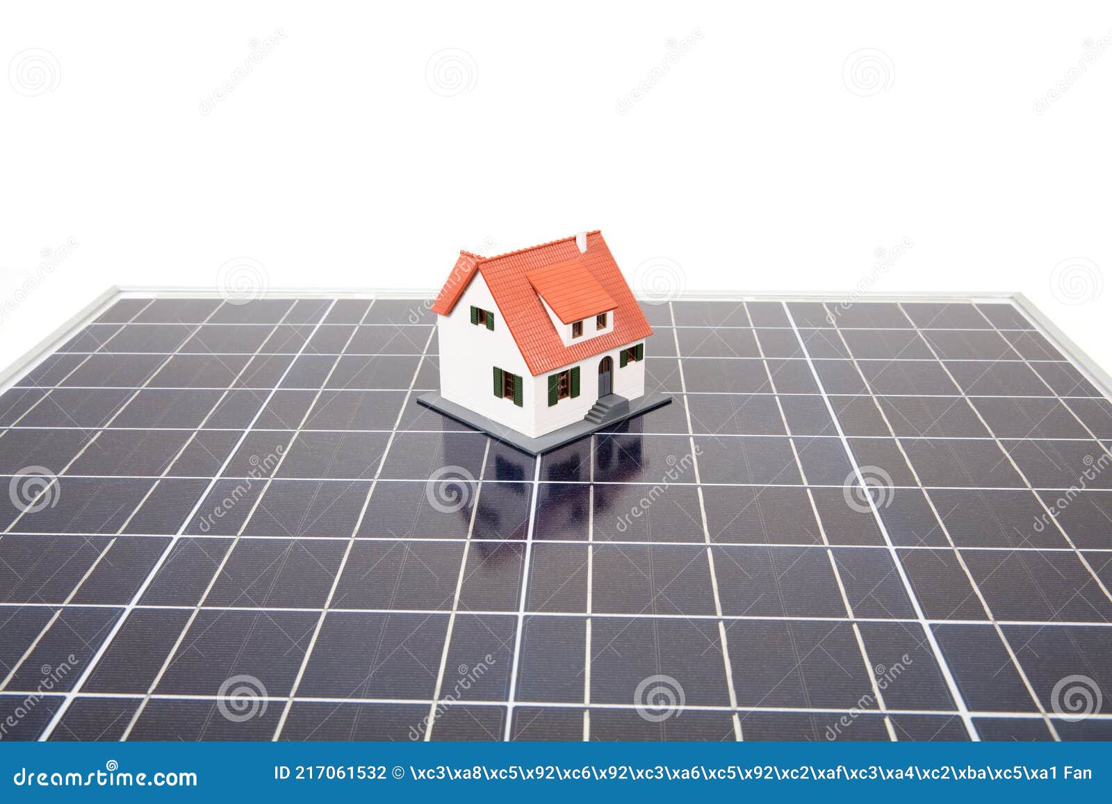A Small House Model on Solar Panels in Front of White Background Stock ...