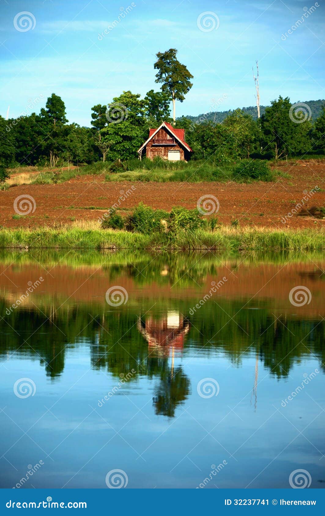 Small house near the river stock image. Image of reflection - 32237741