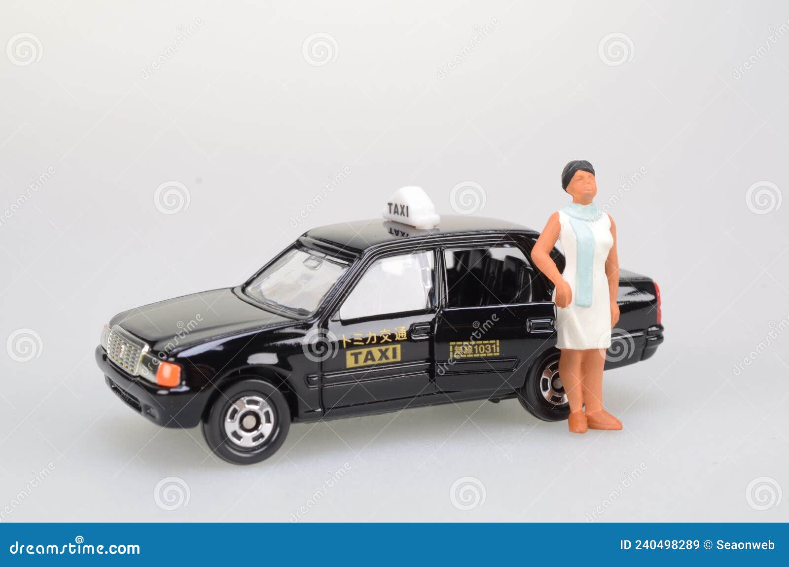 Small Human Figure and a Taxi Stock Image - Image of model, tourists ...