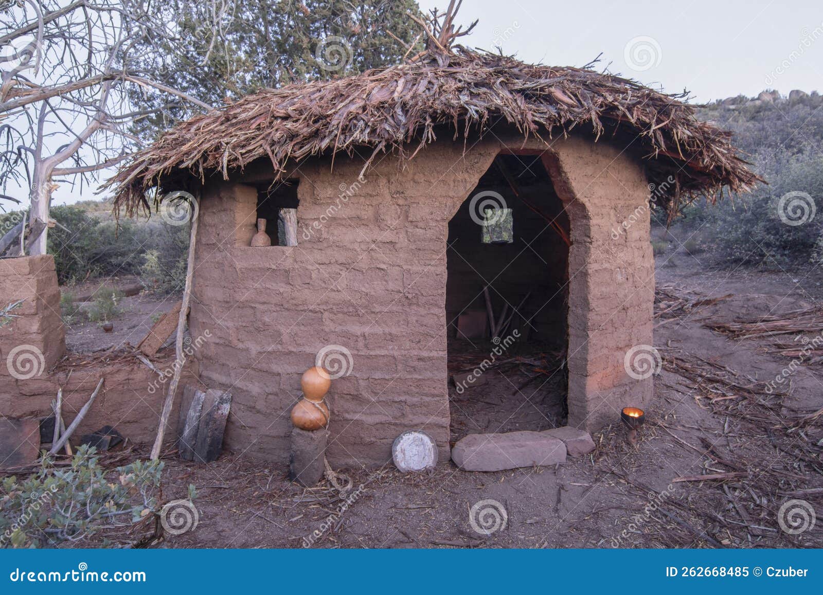 Primitive adobe hut stock image. Image of roof, small - 262668485