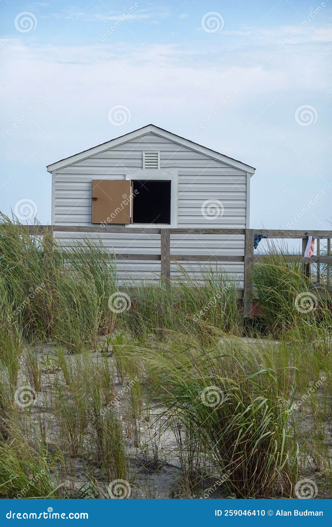 Small Hut on a Sandy Beach Surrounded by Tall Grass with it`s Window ...