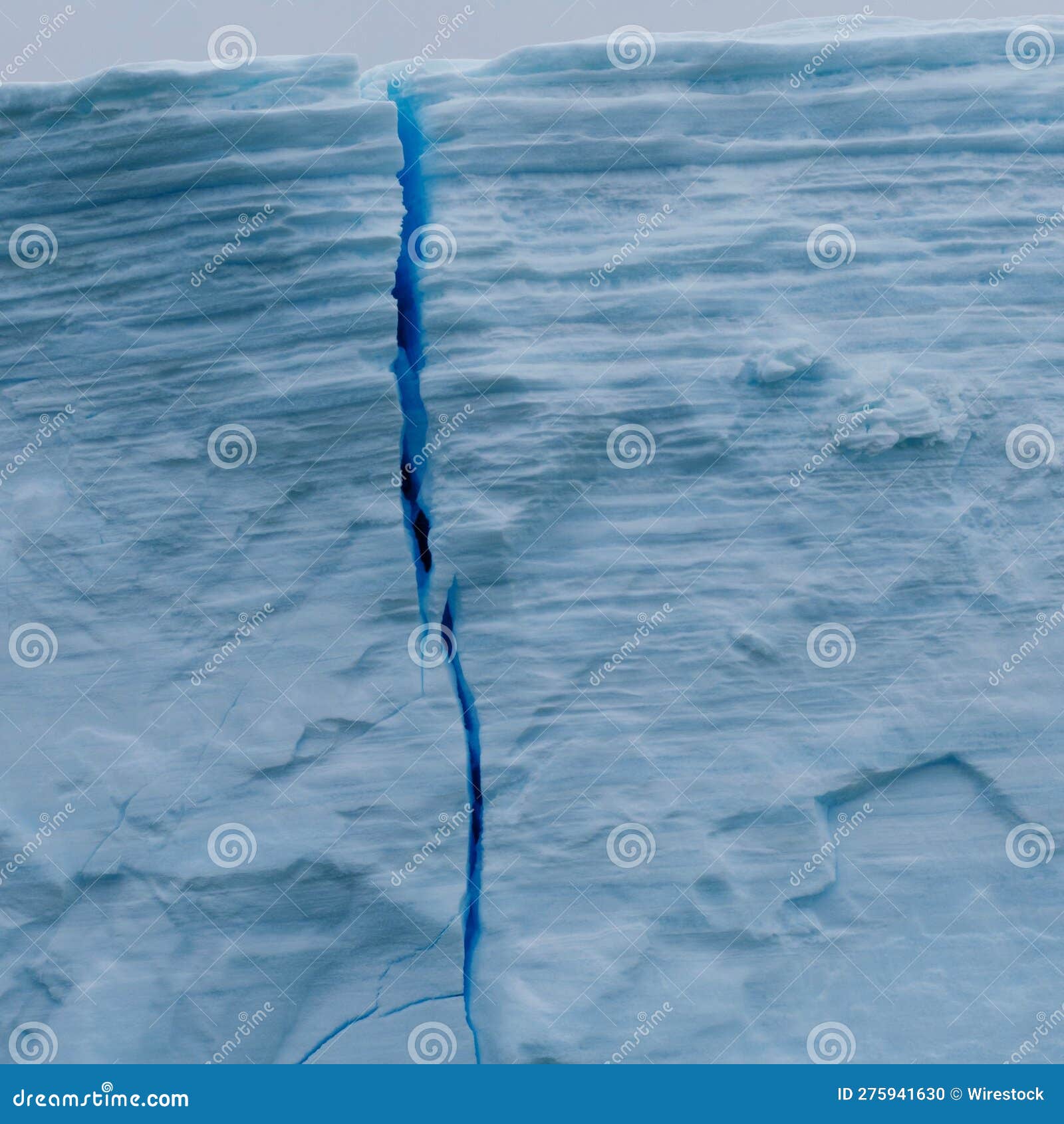 A Small Iceberg with Melting and Cracks that Make it Look Like an Ocean ...