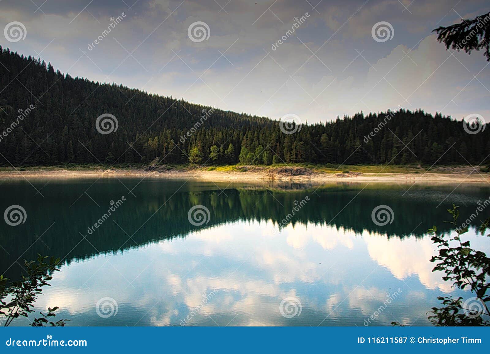 A Small Idyllic Lake with a Smooth Surface Reflecting Stock Image ...