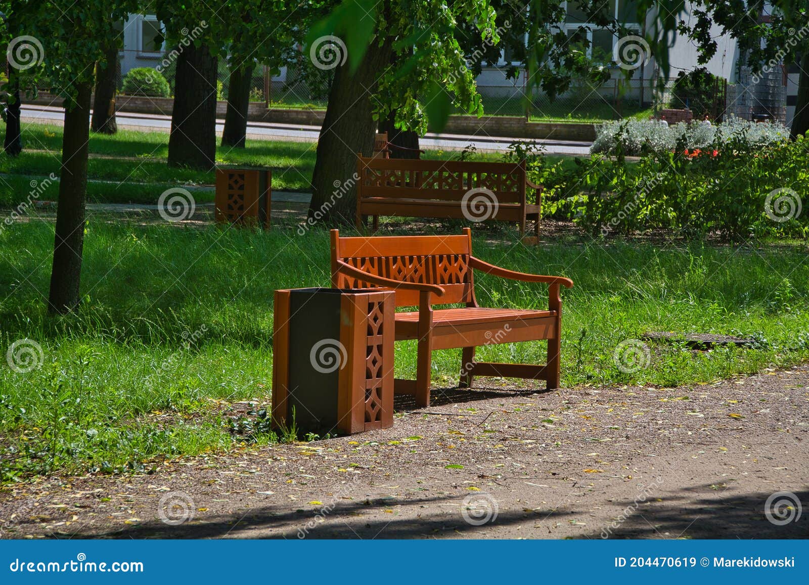 A Bench and a Garbage Can in a Public Park. Stock Image - Image of ...