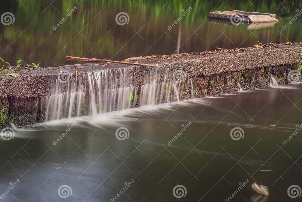 Small Irrigation Dam with Water Flowing Stock Photo - Image of blue ...