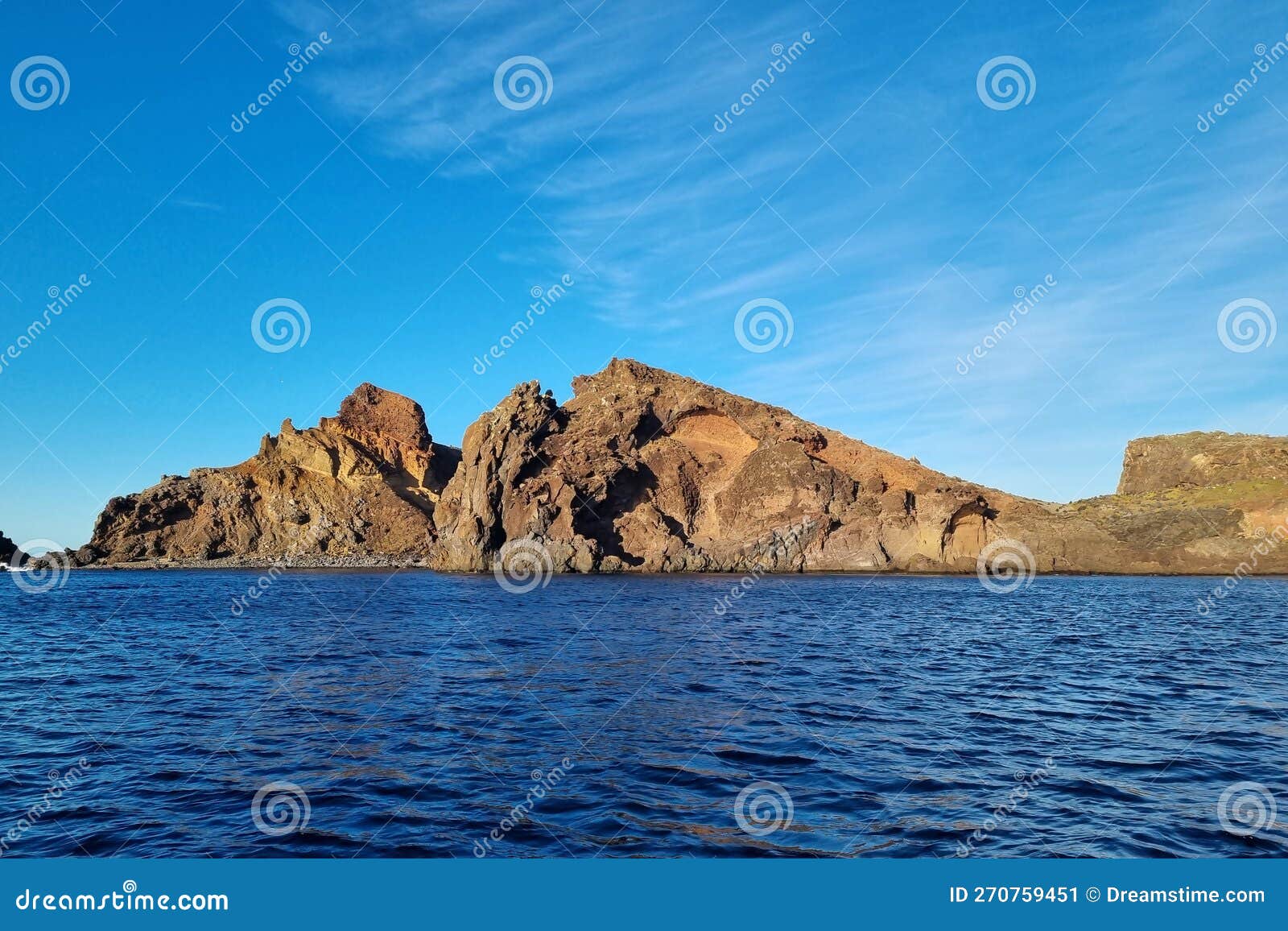 Small Islands in the Ocean. View of the Red Rocks of the Mountain ...