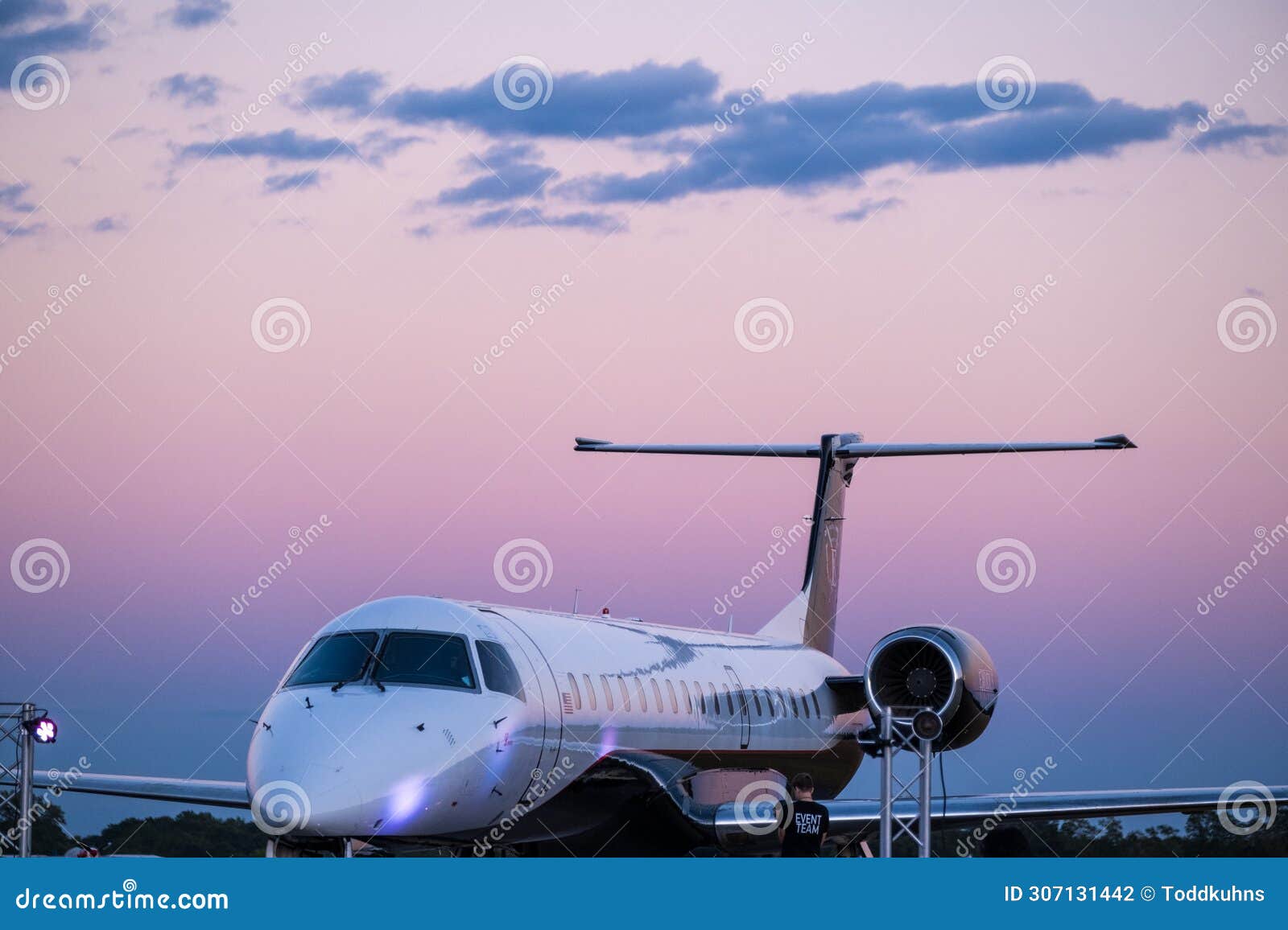 Small Jet Airplane on Runway at Sunset Stock Photo - Image of beautiful ...