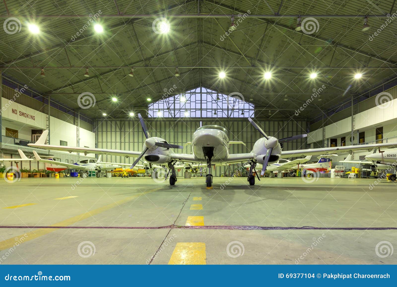 Small jets in a hangar editorial stock image. Image of transport - 69377104