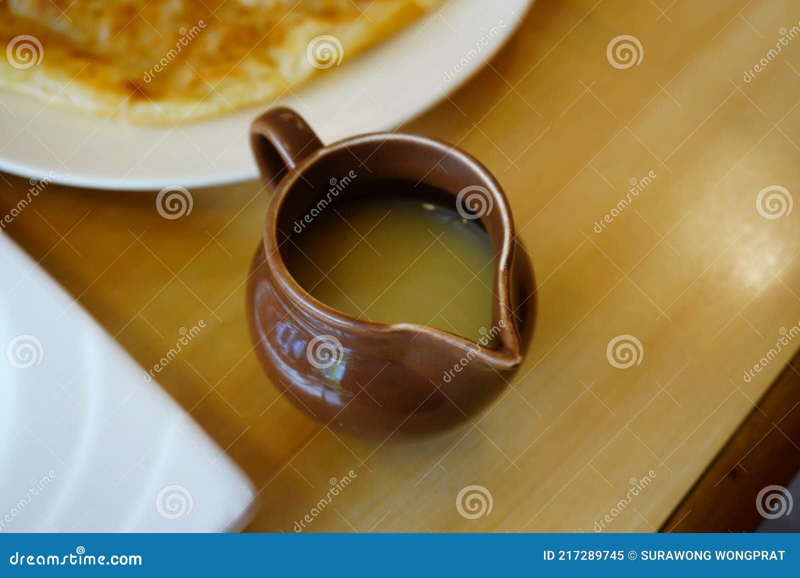 A Small Jug of Sweetened Condensed Milk. Stock Image - Image of ...
