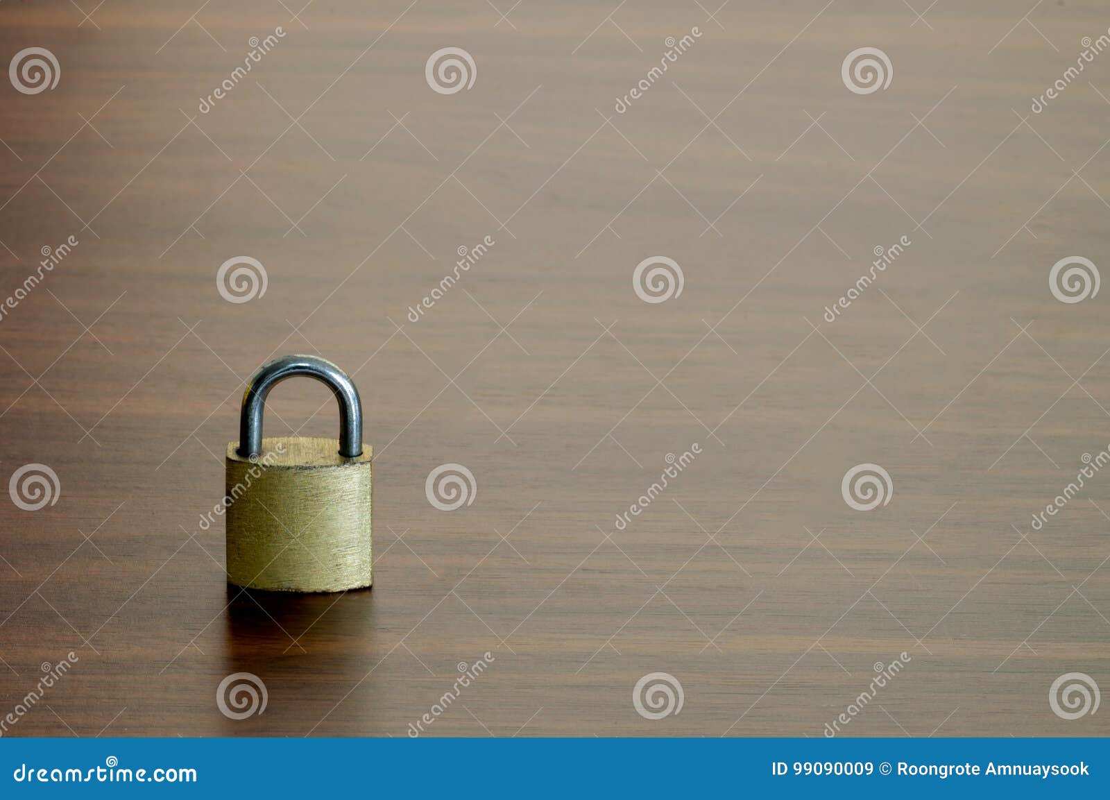 The Small Key Lock on the Wooden Table Background Stock Image - Image ...