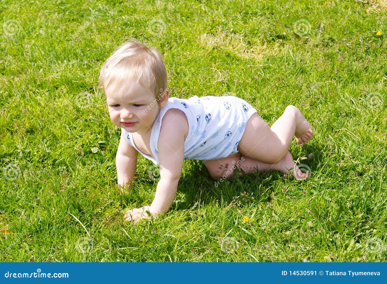 The Small Kid Creeps on a Grass Stock Image - Image of close, lawn ...