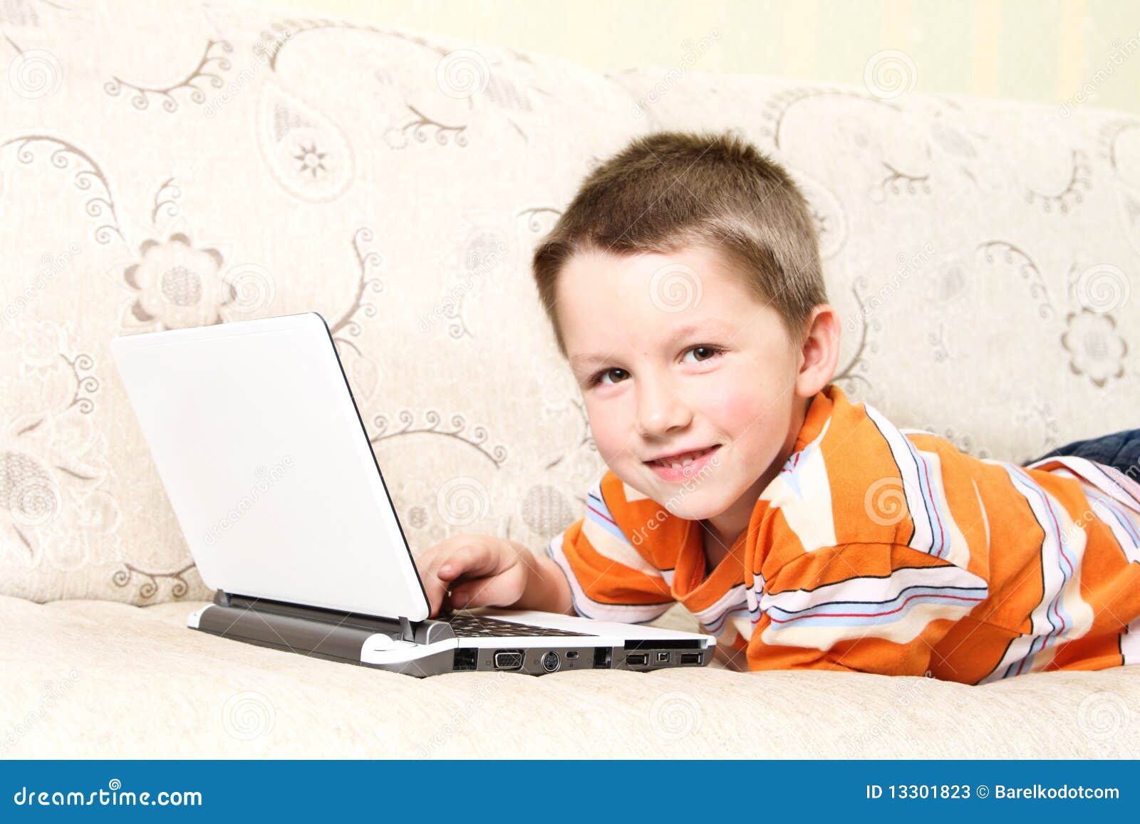 Small kid with laptop stock image. Image of game, laying - 13301823